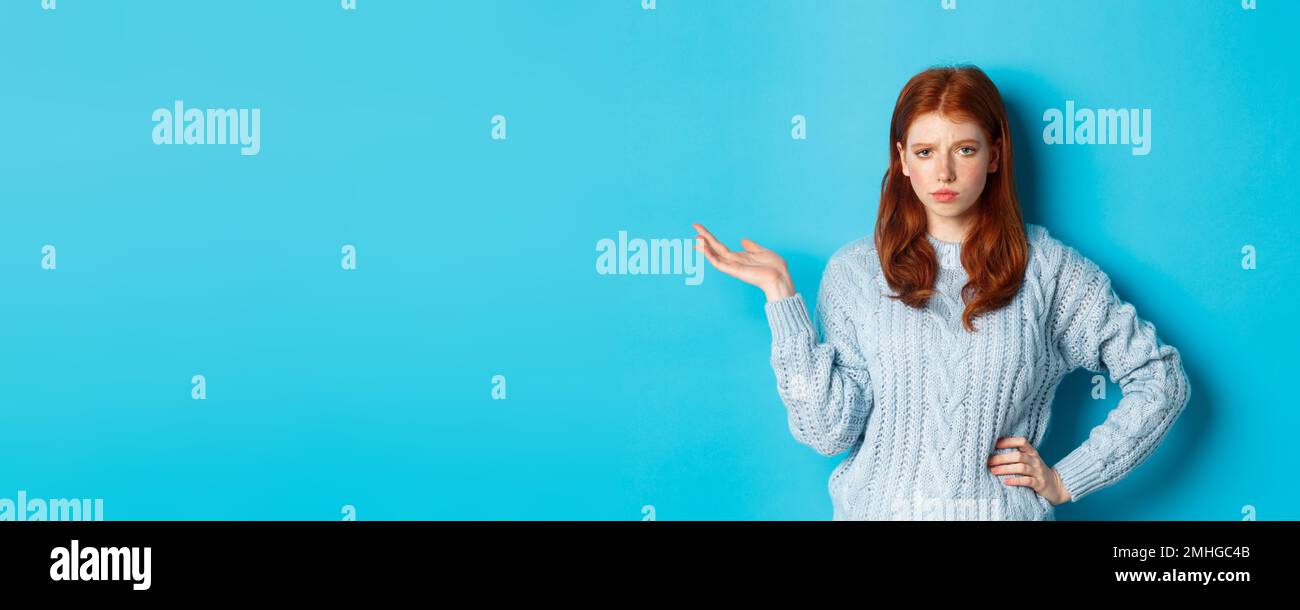Skeptical teenage girl looking unamused, raising hand in so what ...