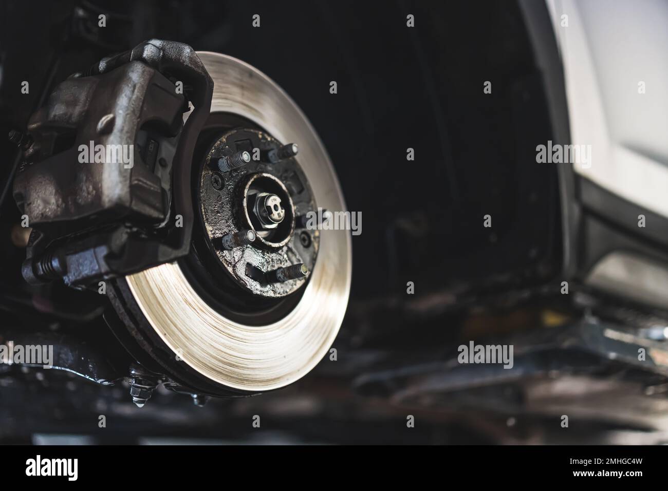 Closeup disc brake of vehicle for repair - Tire replacement car brake ...