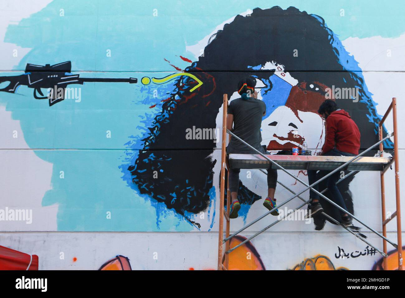 In this Sunday, Nov. 17, 2019 photo, Iraqi artists draw graffiti at the ...