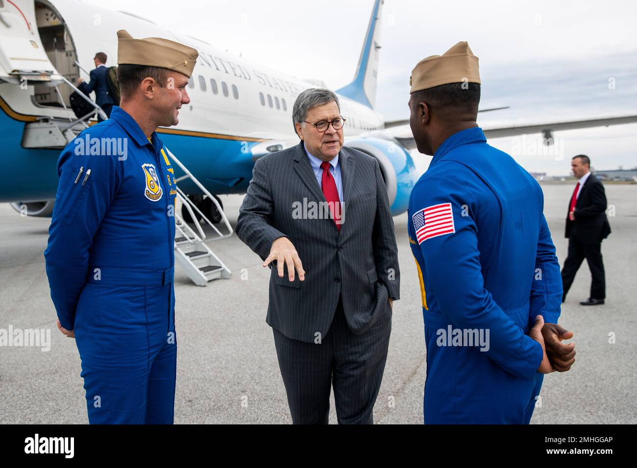 Attorney General William Barr speaks with Lt. Commander Adam Kerrick ...