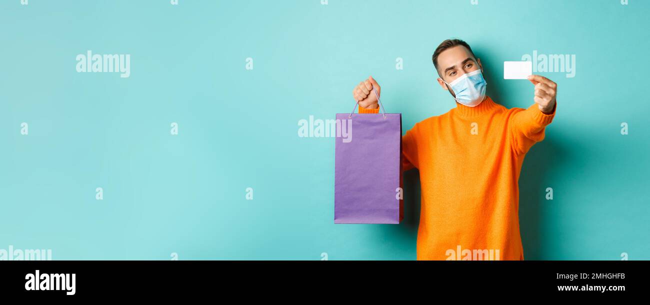 Covid-19, pandemic and lifestyle concept. Happy male customer in face ...