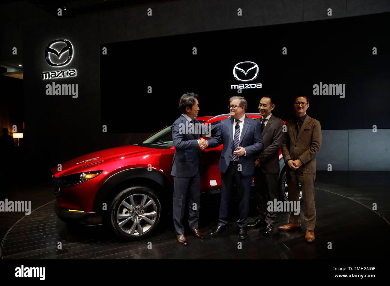 Mazda Executives, from left, Masahiro Moro, Jeffrey Guyton, Naohito ...