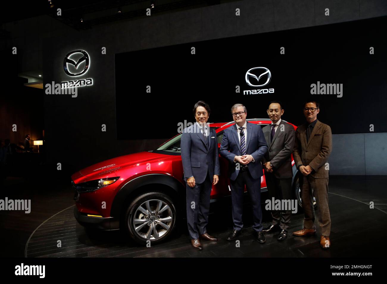 Mazda Executives, from left, Masahiro Moro, Jeffrey Guyton, Naohito ...
