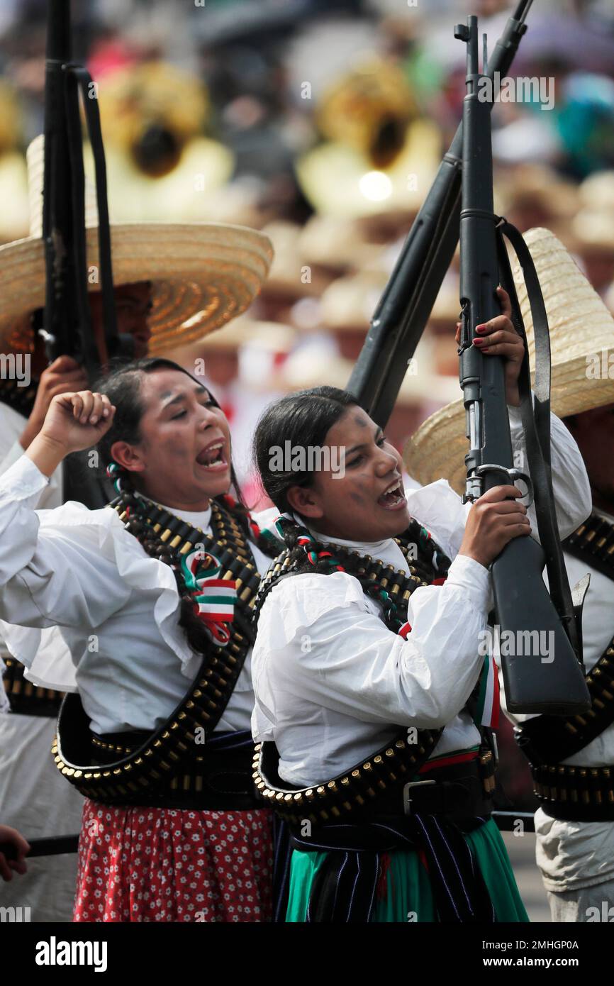 Women dressed as Mexican revolutionary soldiers known as Adelitas take ...
