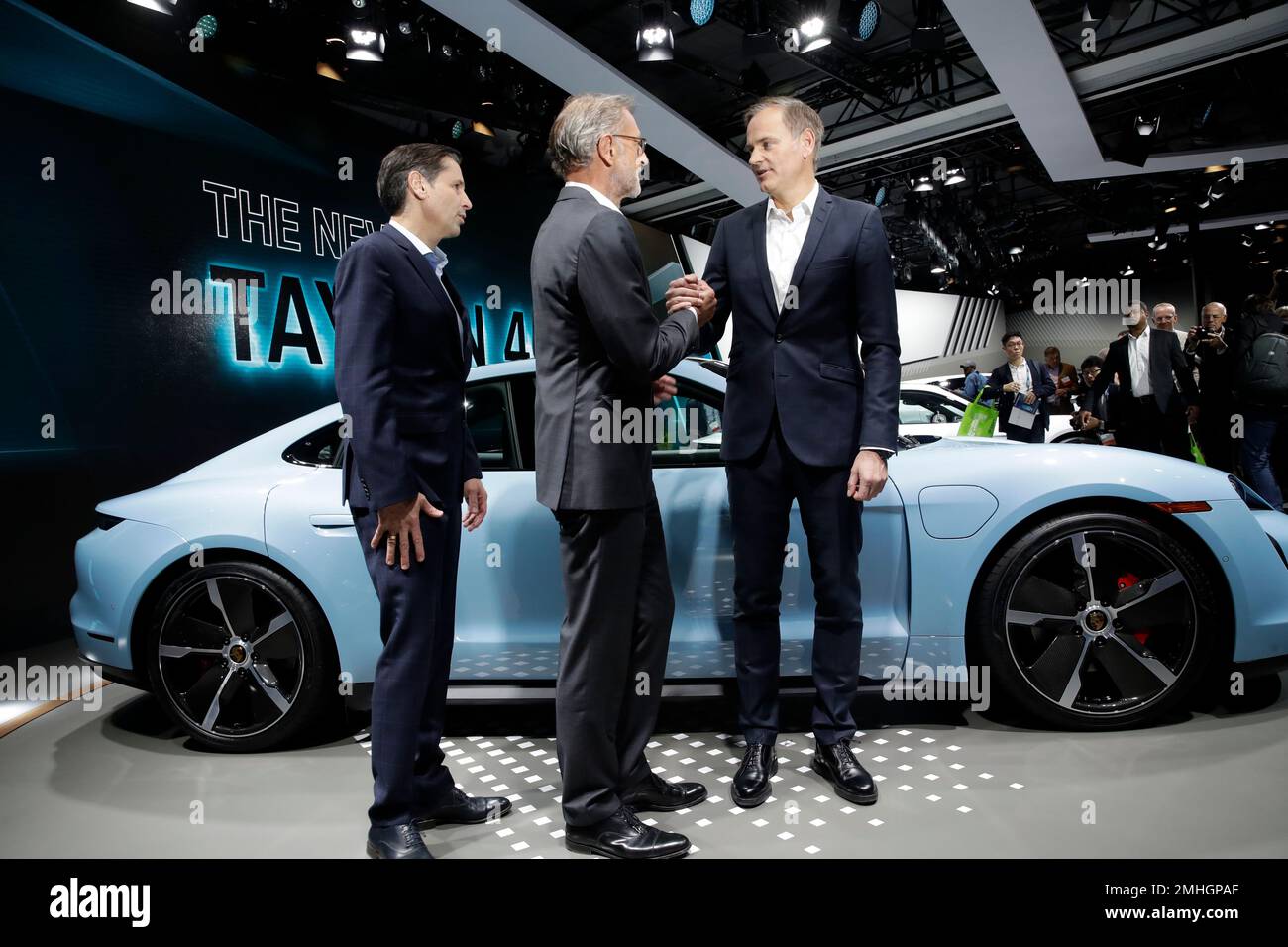 Porsche executives, from left, Klaus Zellmer, Detlev von Platen, and ...