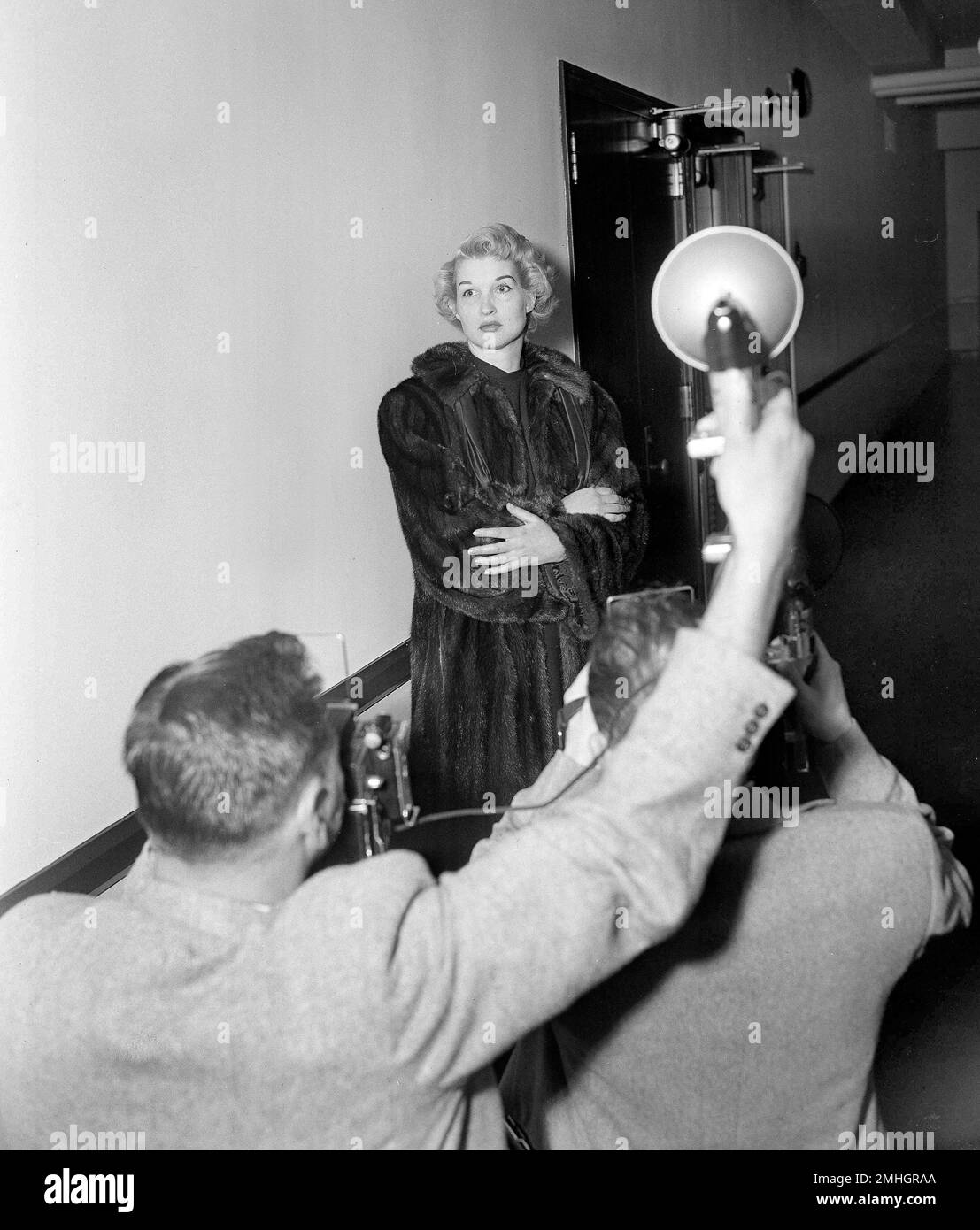 Mrs. Diane Wells stares blankly as she poses for photographers in the ...