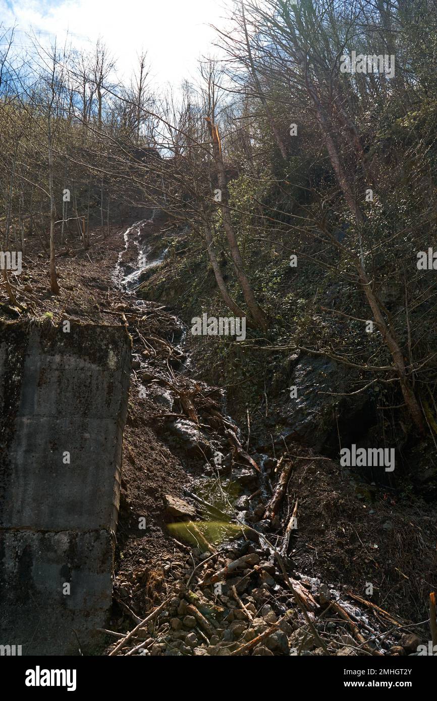 A huge rock fell from the mountains onto the road, destroying the ...