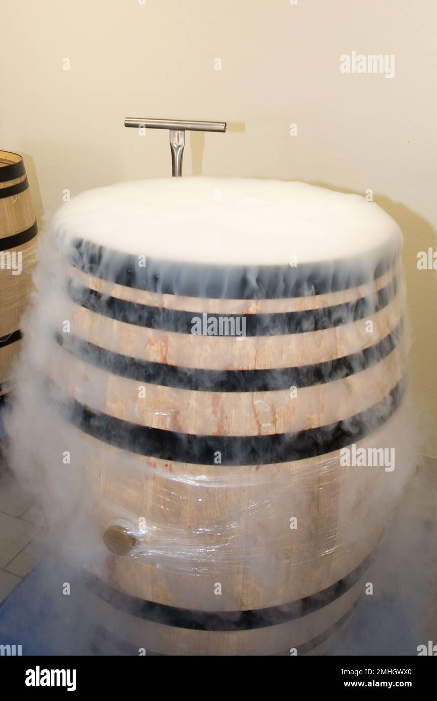 wood barrel in cellar white smoke dry ice in harvest wooden barrels for ...