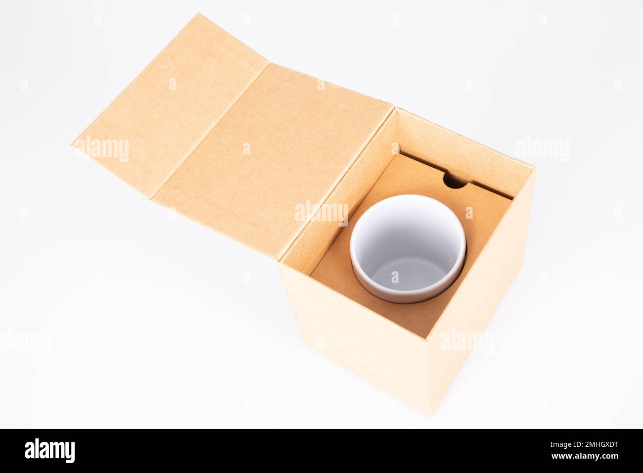 Box packaging open with mug in white background Stock Photo - Alamy