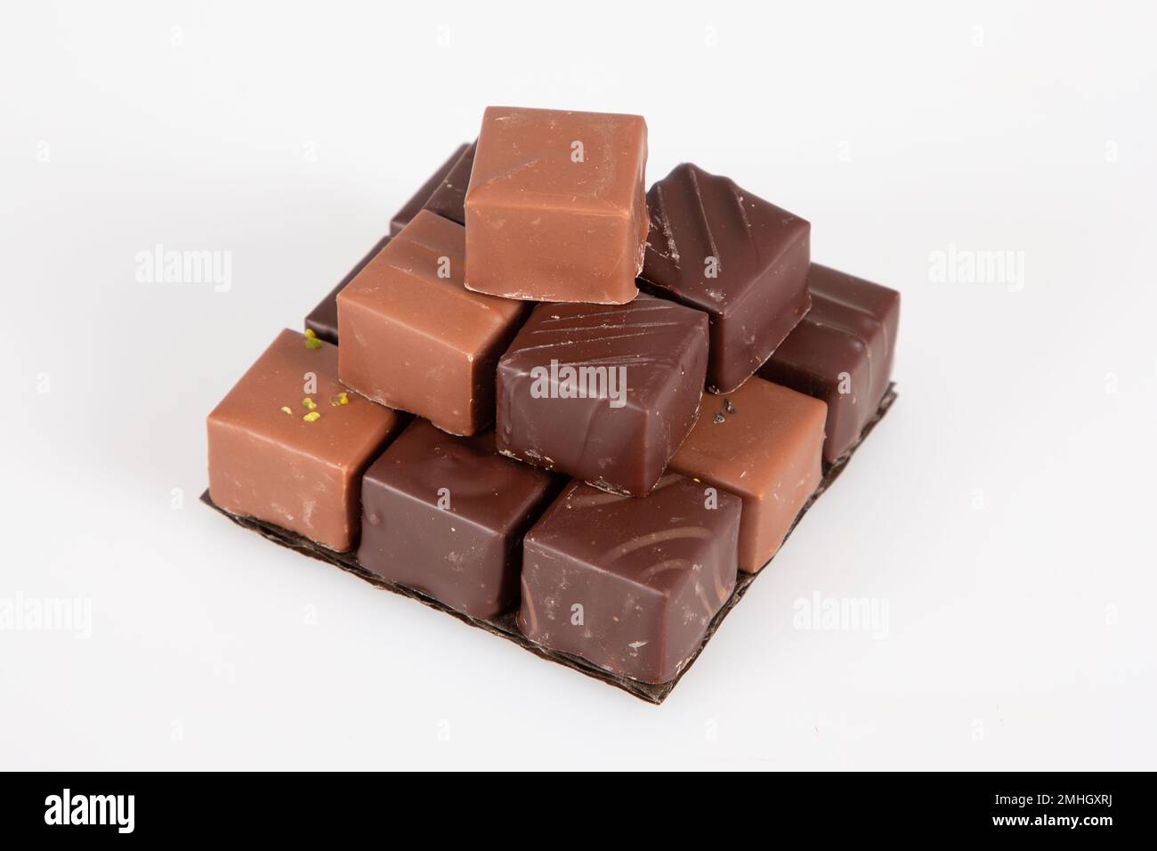 some piece chocolate pralines in pyramid view in white background Stock ...