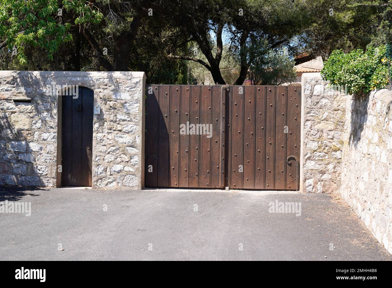 Brown wooden gate and door closed of private house suburb wood portal ...
