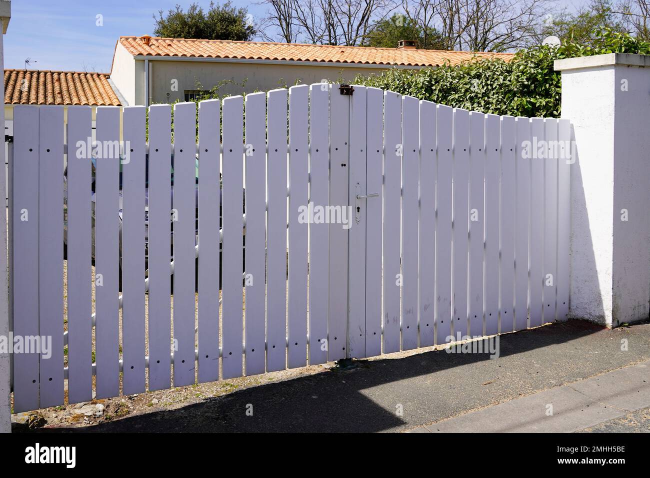 PVC gate of modern house white home door slats Stock Photo - Alamy