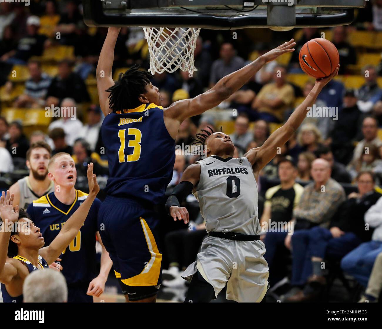 UC Irvine forward Austin Johnson (13) goes up to block a shot by ...