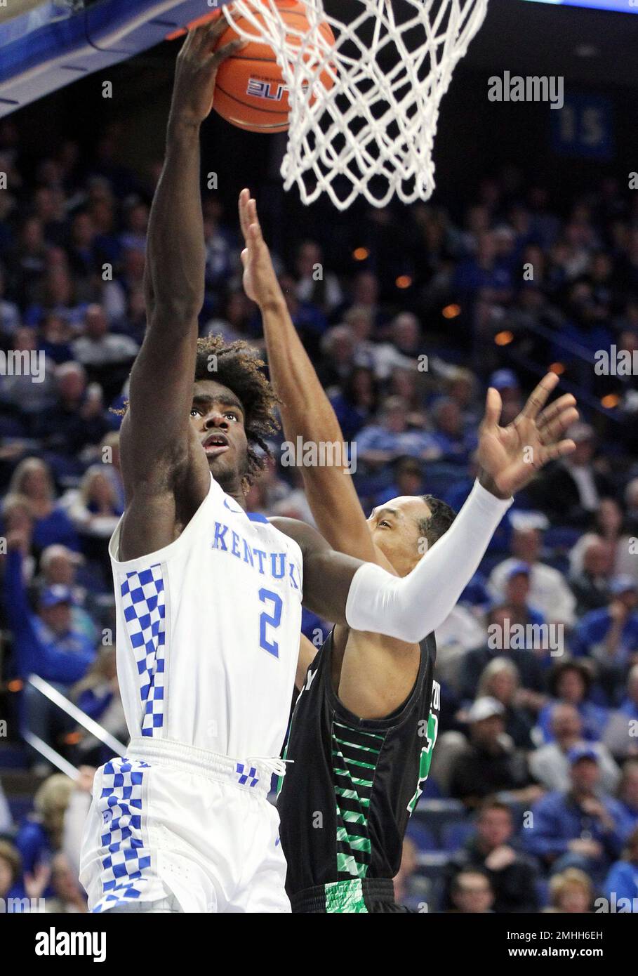 Kentucky's Kahlil Whitney, left, shoots while defended by Utah Valley's ...