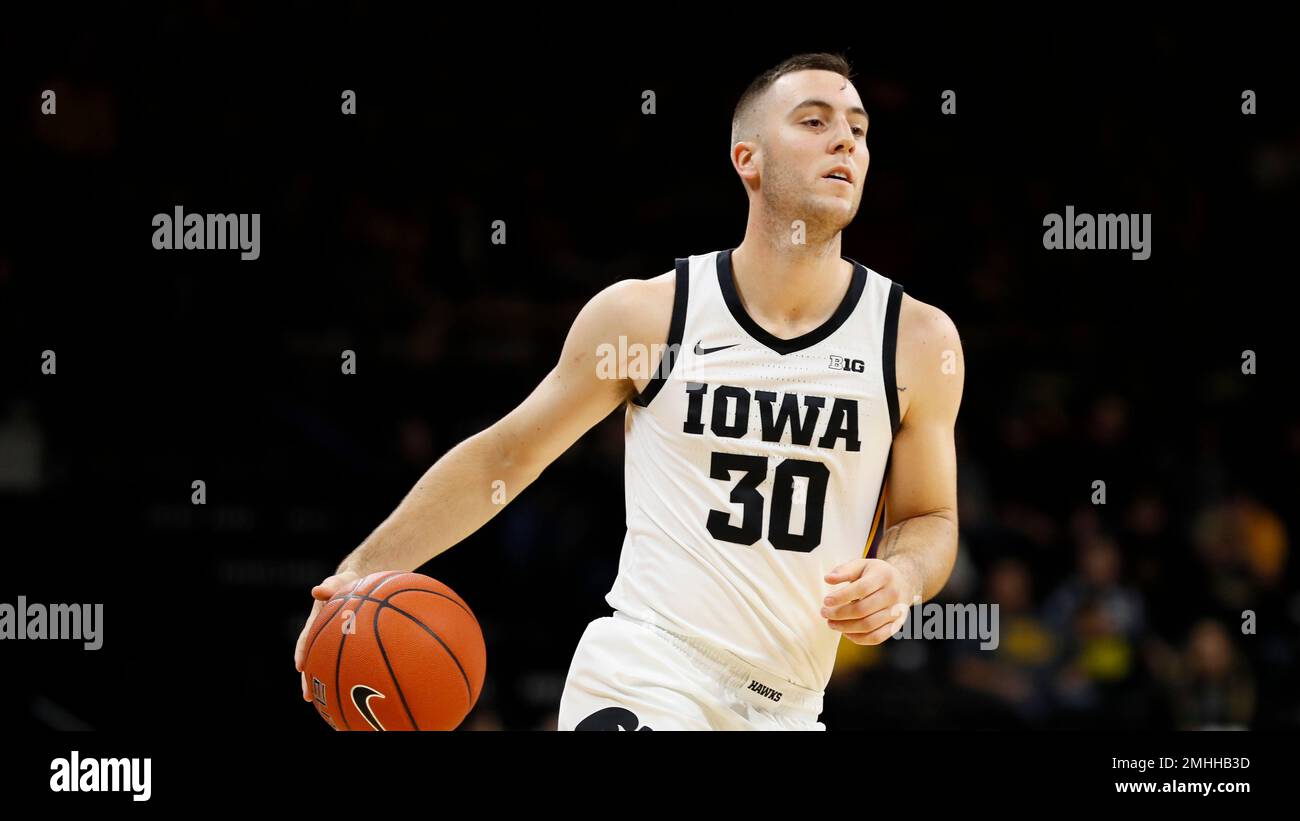 Iowa guard Connor McCaffery drives up court during the first half of an ...