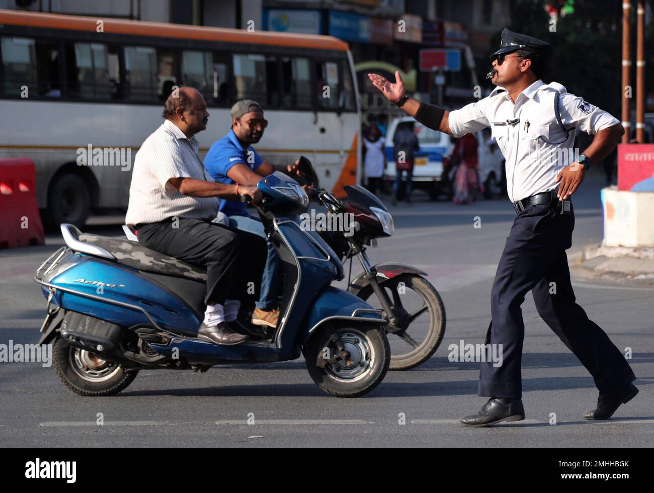 Ranjeet Singh, an Indian traffic policeman directs commuters at a busy ...