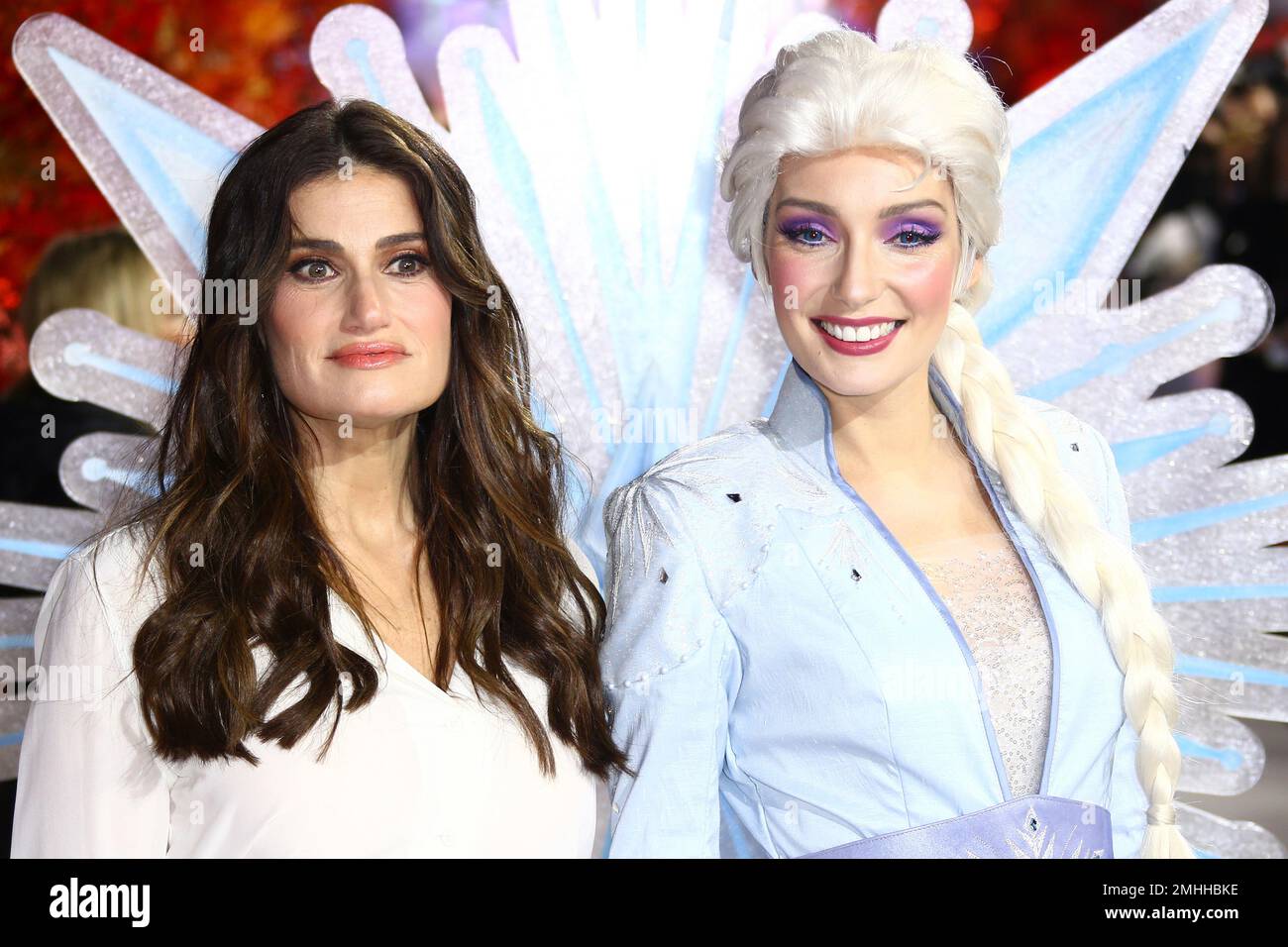 Voice actress Idina Menzel, left, poses for photographers alongside the ...