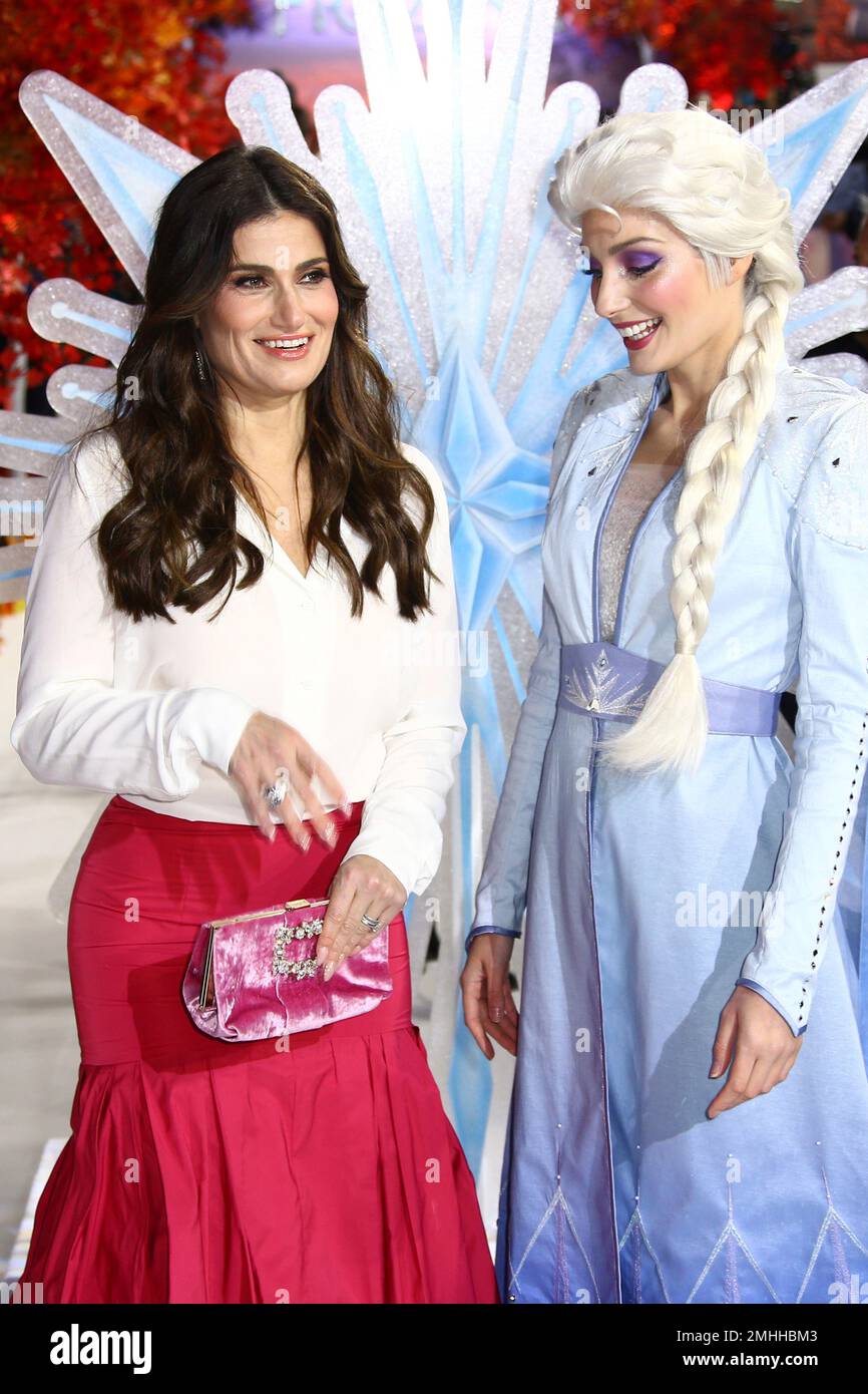 Voice actress Idina Menzel, left, poses for photographers alongside the ...