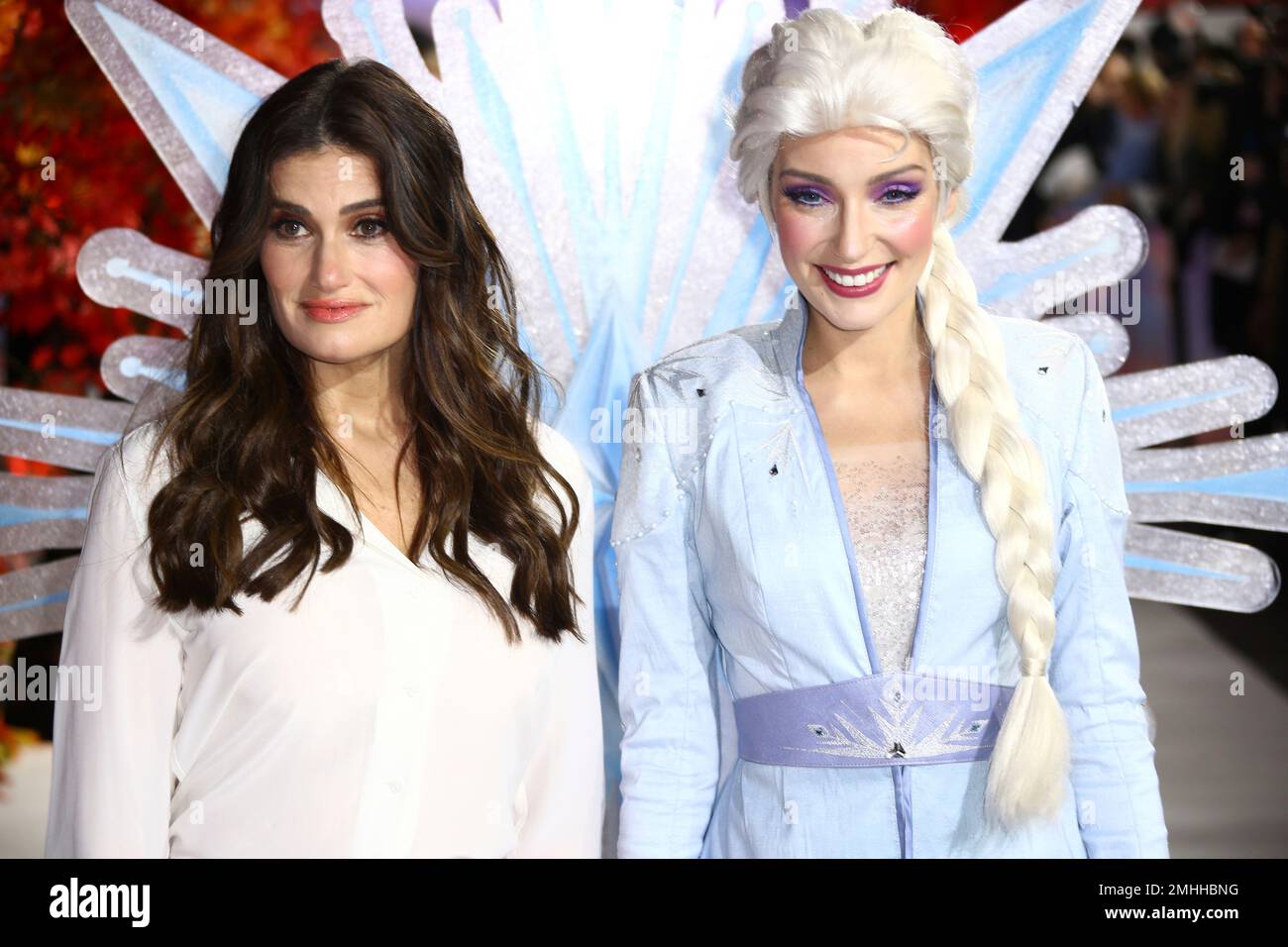 Voice actress Idina Menzel, left, poses for photographers alongside the ...