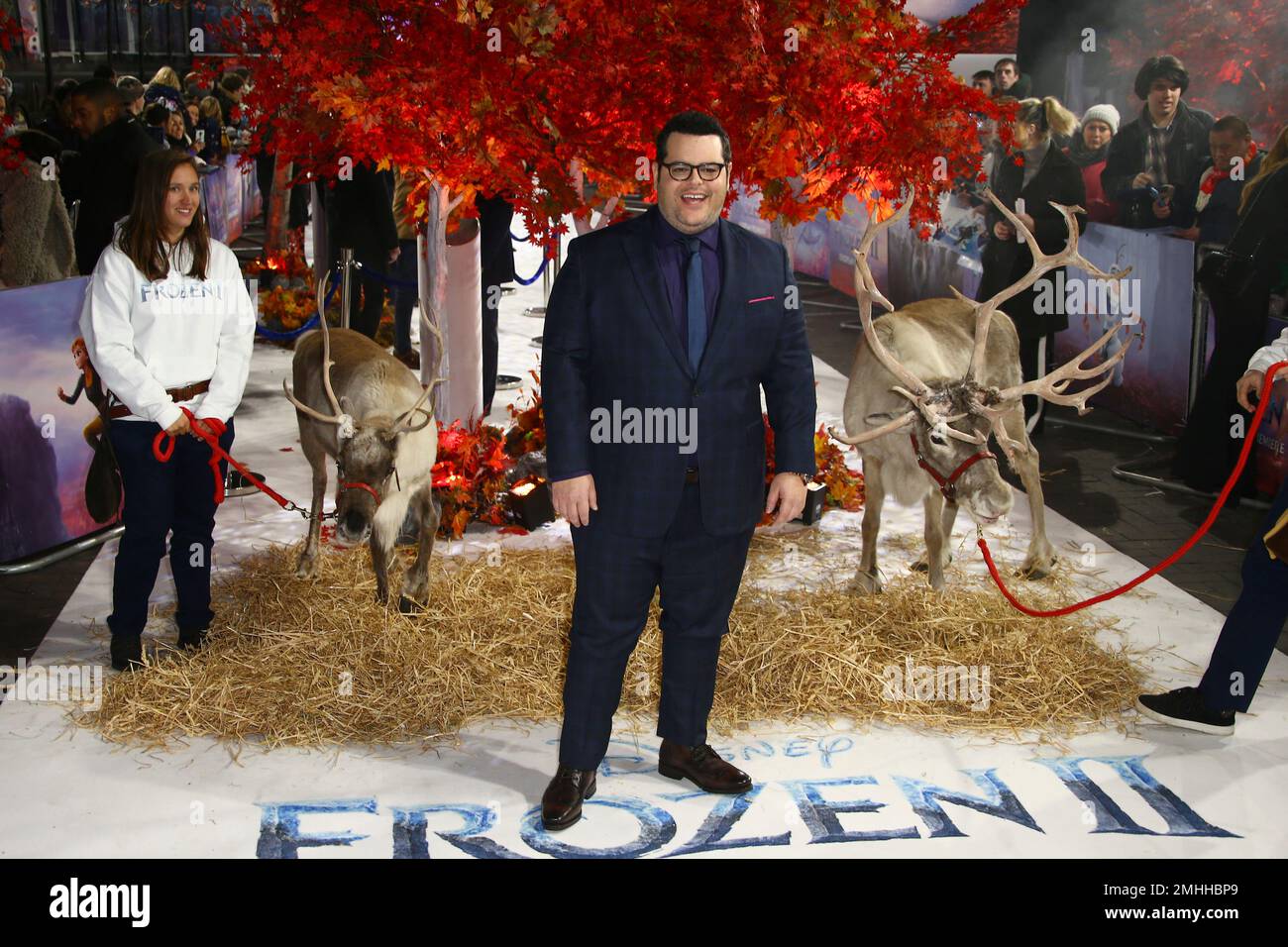 Voice actor Josh Gad poses for photographers alongside reindeer upon ...