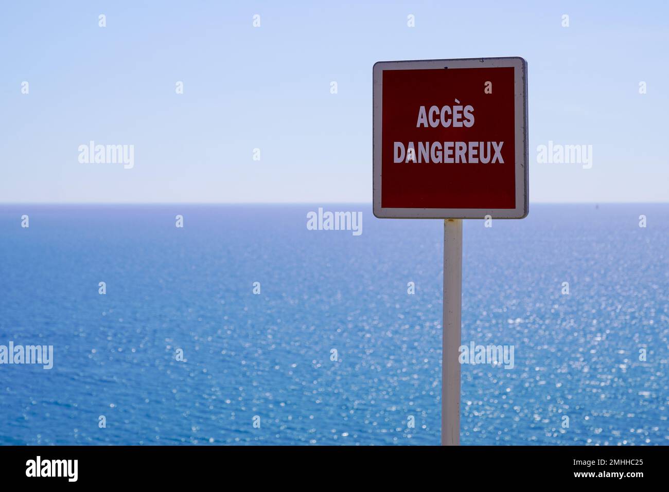 acces dangereux text french panel sign means dangerous access on sea ...