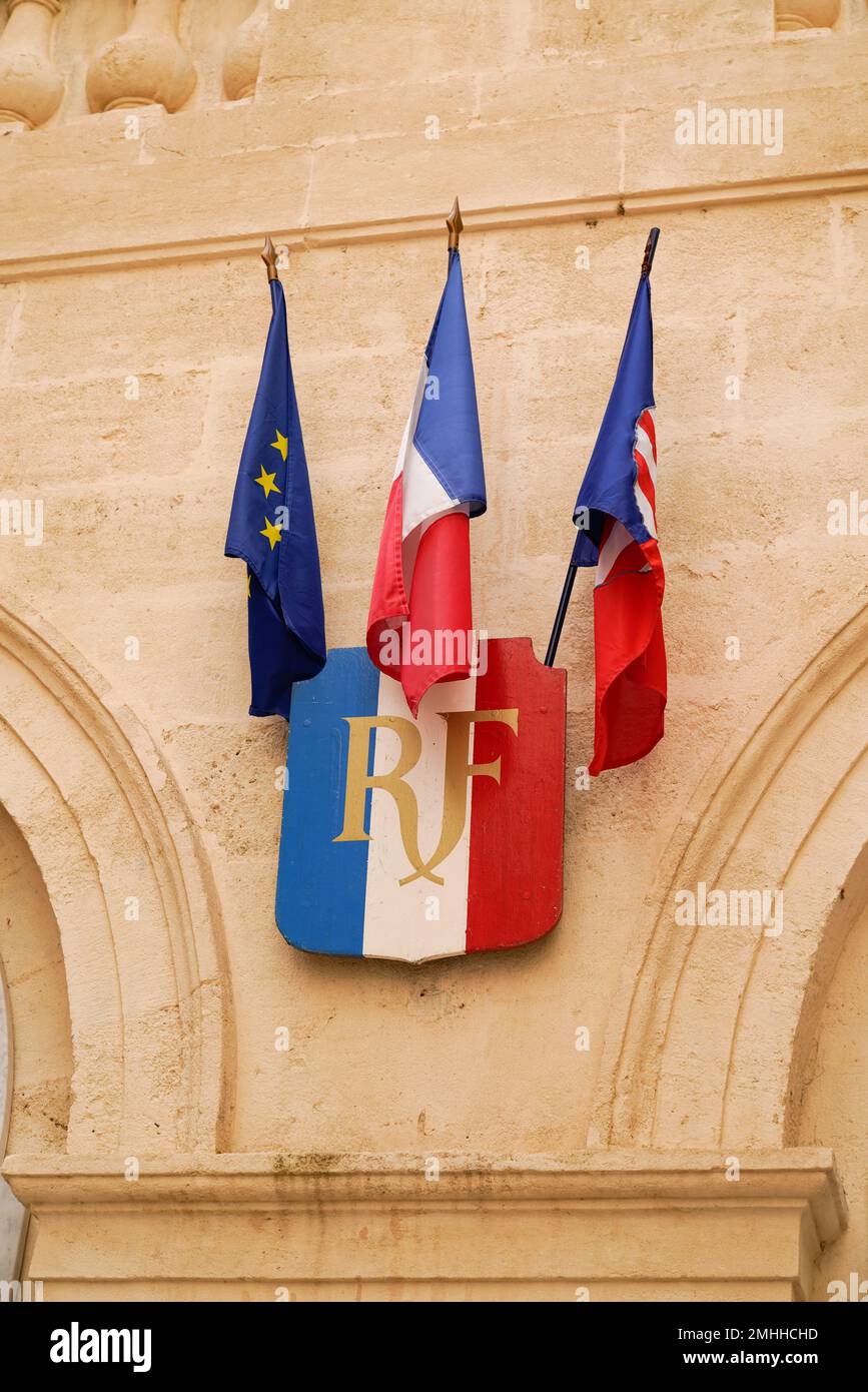 city hall facade with french europe flag on town hall entrance in ...