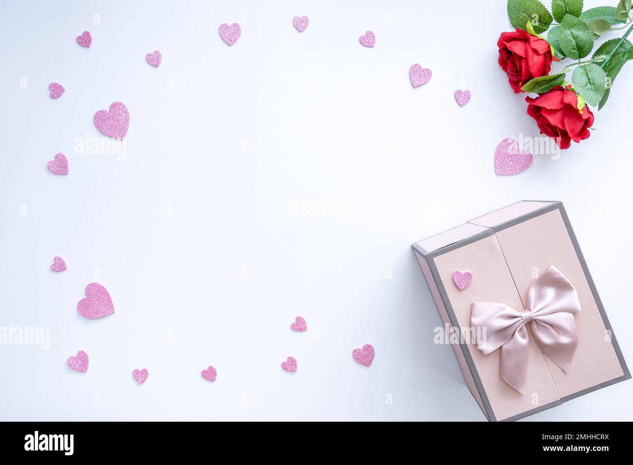 Beautiful Valentine's Day background with red hearts, red roses and ...