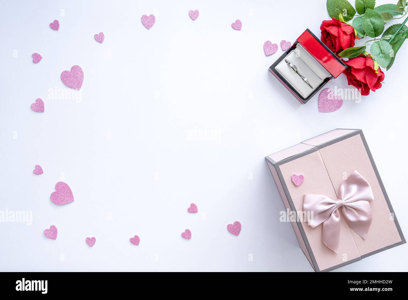 Beautiful Valentine's Day background with red hearts, roses, gift box ...