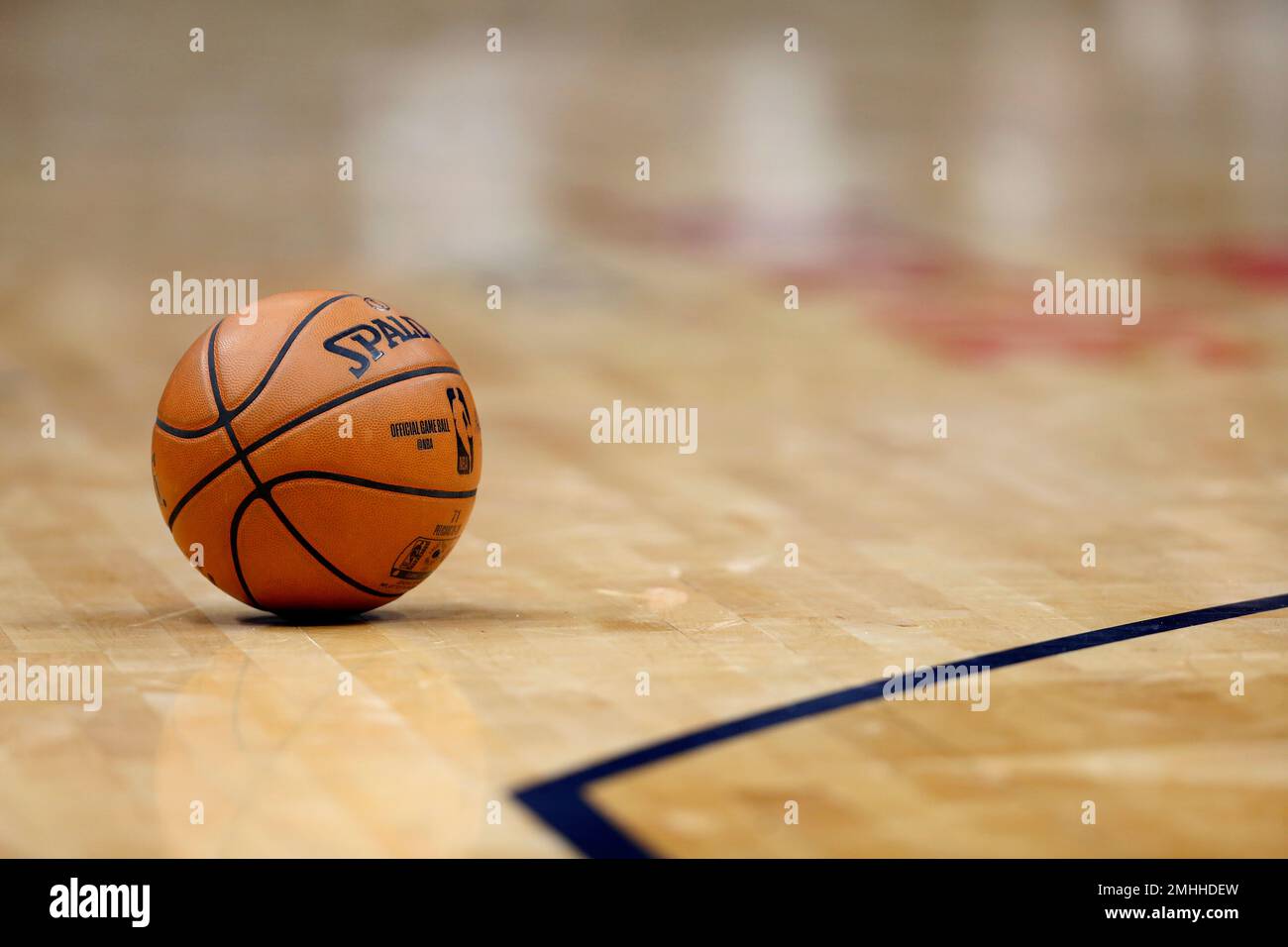 A basketball on the court in the first half of an NBA basketball game ...
