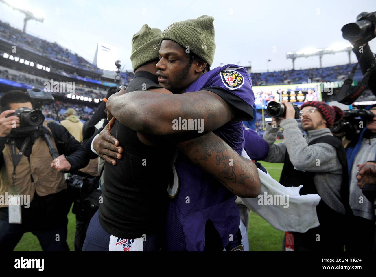 Houston Texans quarterback Deshaun Watson, left, hugs Baltimore Ravens ...