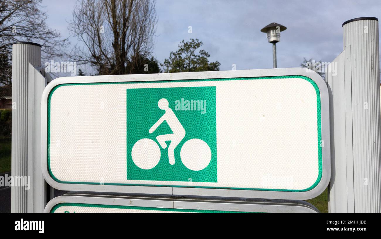 Bicycle lane road sign green for bike path way Stock Photo - Alamy