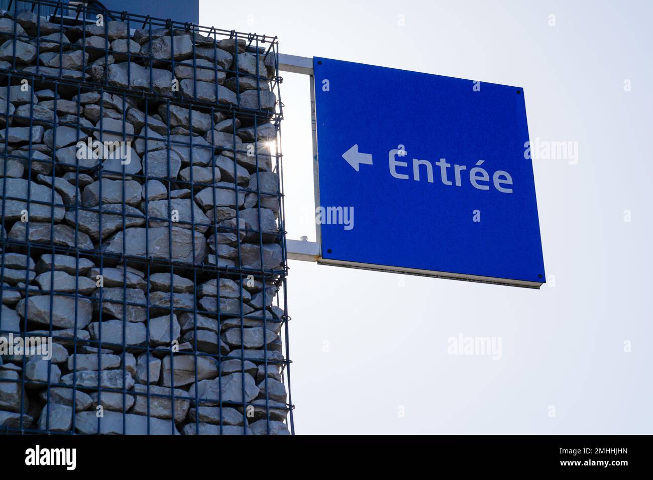 blue sign with arrow indicating in text the entry with an arrow Stock ...