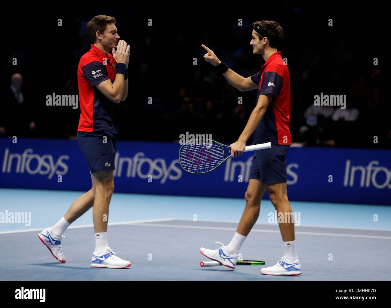 Pierre-Hugues Herbert of France, left and Nicholas Mahut of France ...