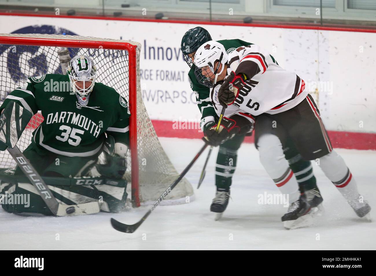 Brown's Ben Taylor (5) shoots as Dartmouth's Adrian Clark (35) makes ...