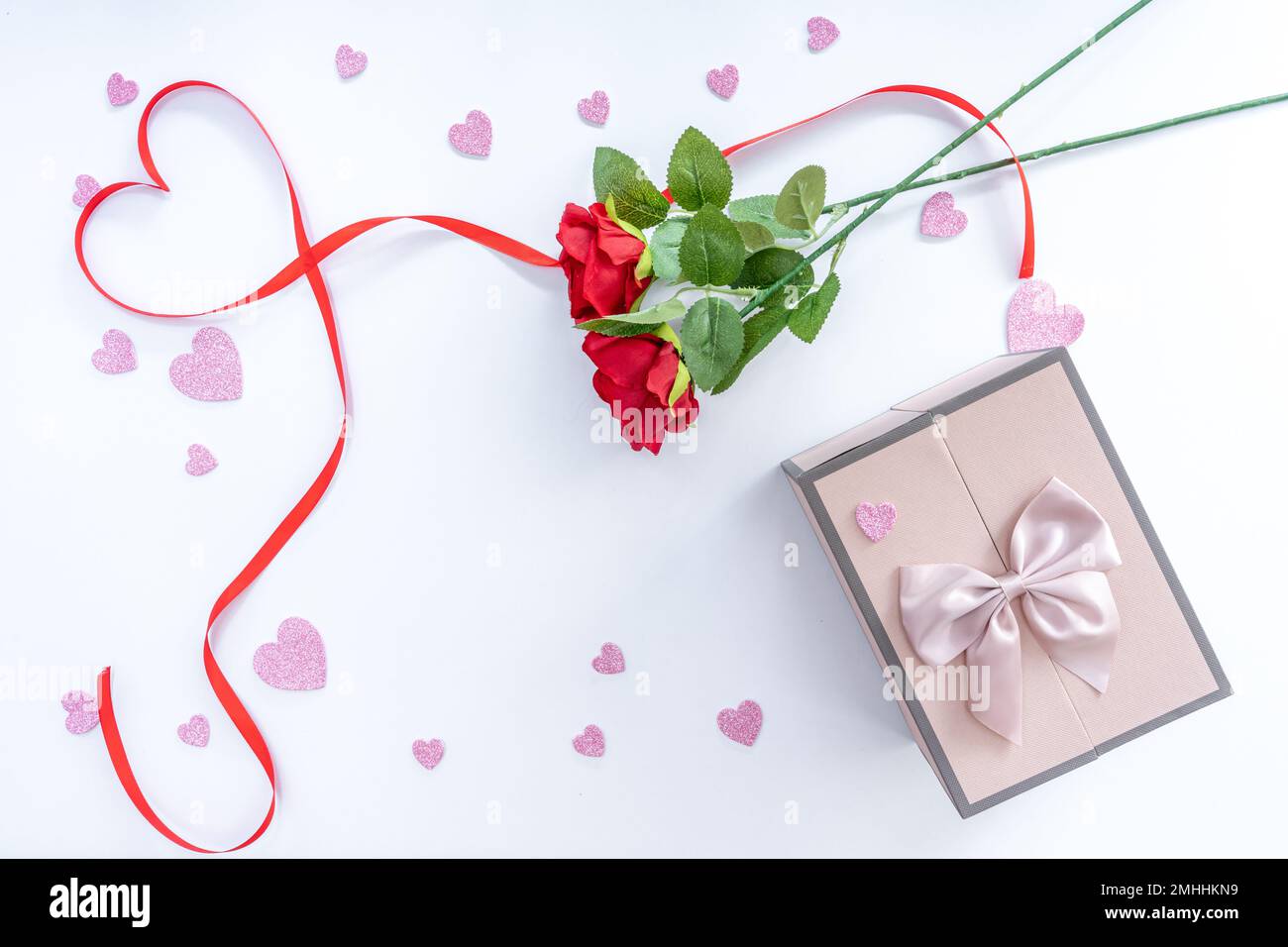 Beautiful Valentine's Day background with red hearts, red roses and ...