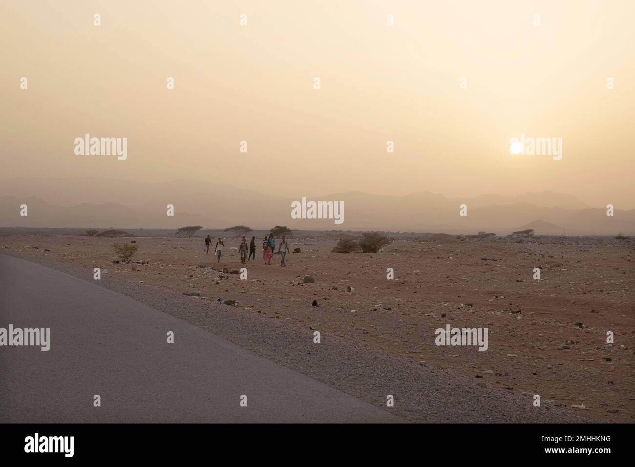 In this July 14, 2019 photo, Ethiopian migrants walk on a road in Obock ...