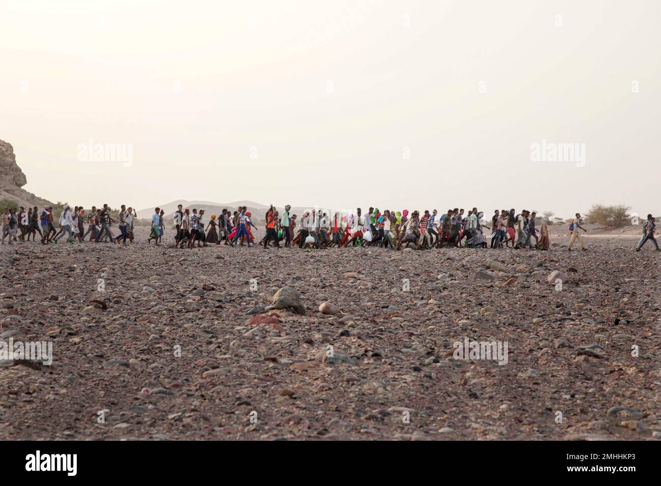 In this July 14, 2019 photo, smugglers lead Ethiopian migrants in Obock ...