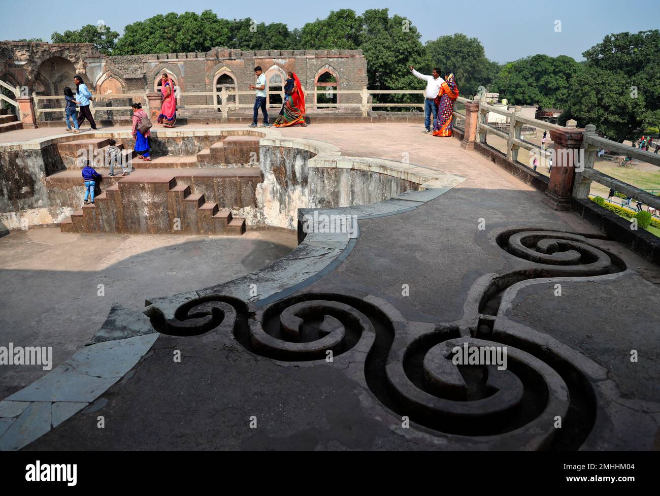 Tourists visit Jahaz Mahal or Ship Palace in Mandu also known as Mandav ...