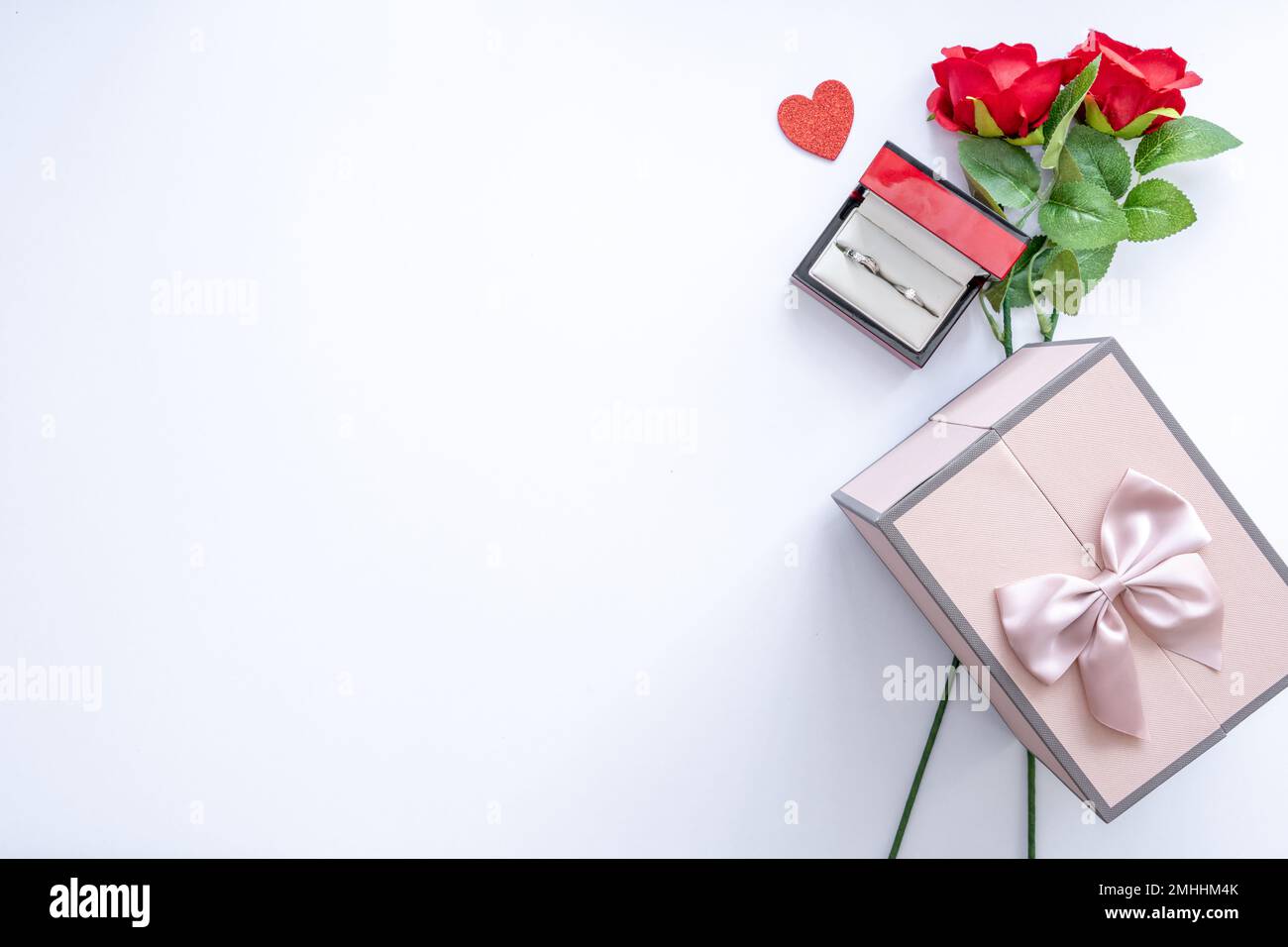 Beautiful Valentine's Day background with red hearts, roses, gift box ...