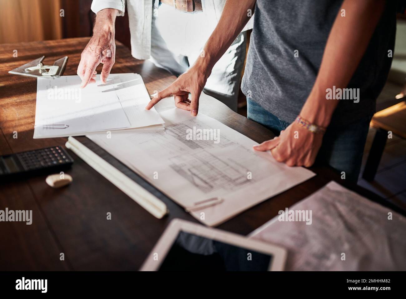 Together well create something amazing. two unrecognizable men working ...