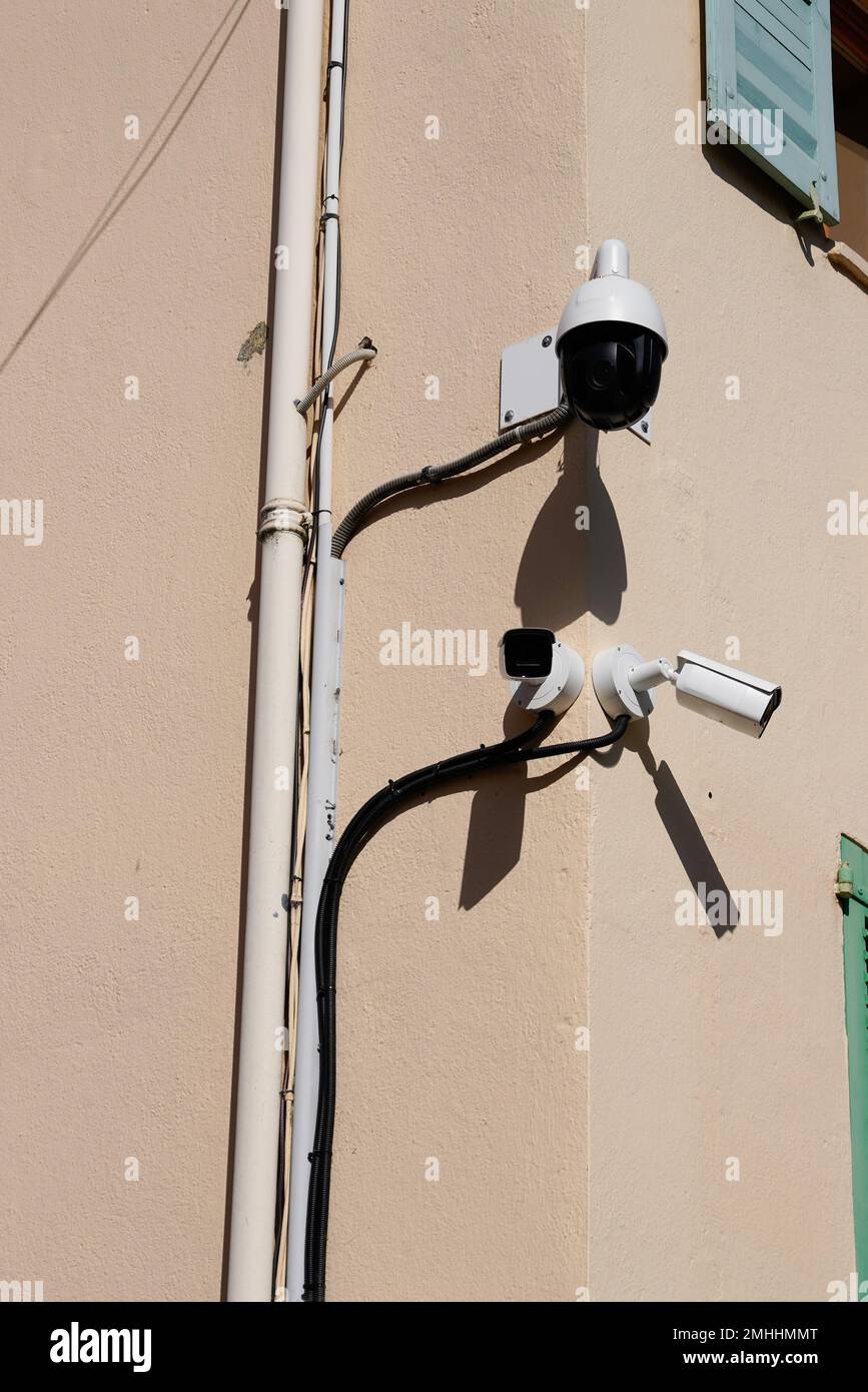 Security three cctv and round camera on facade wall building Stock ...
