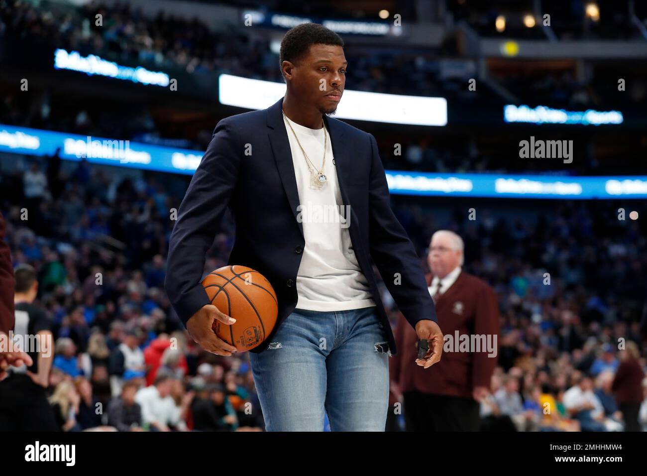 Toronto Raptors' Kyle Lowry stands by the bench during an NBA ...