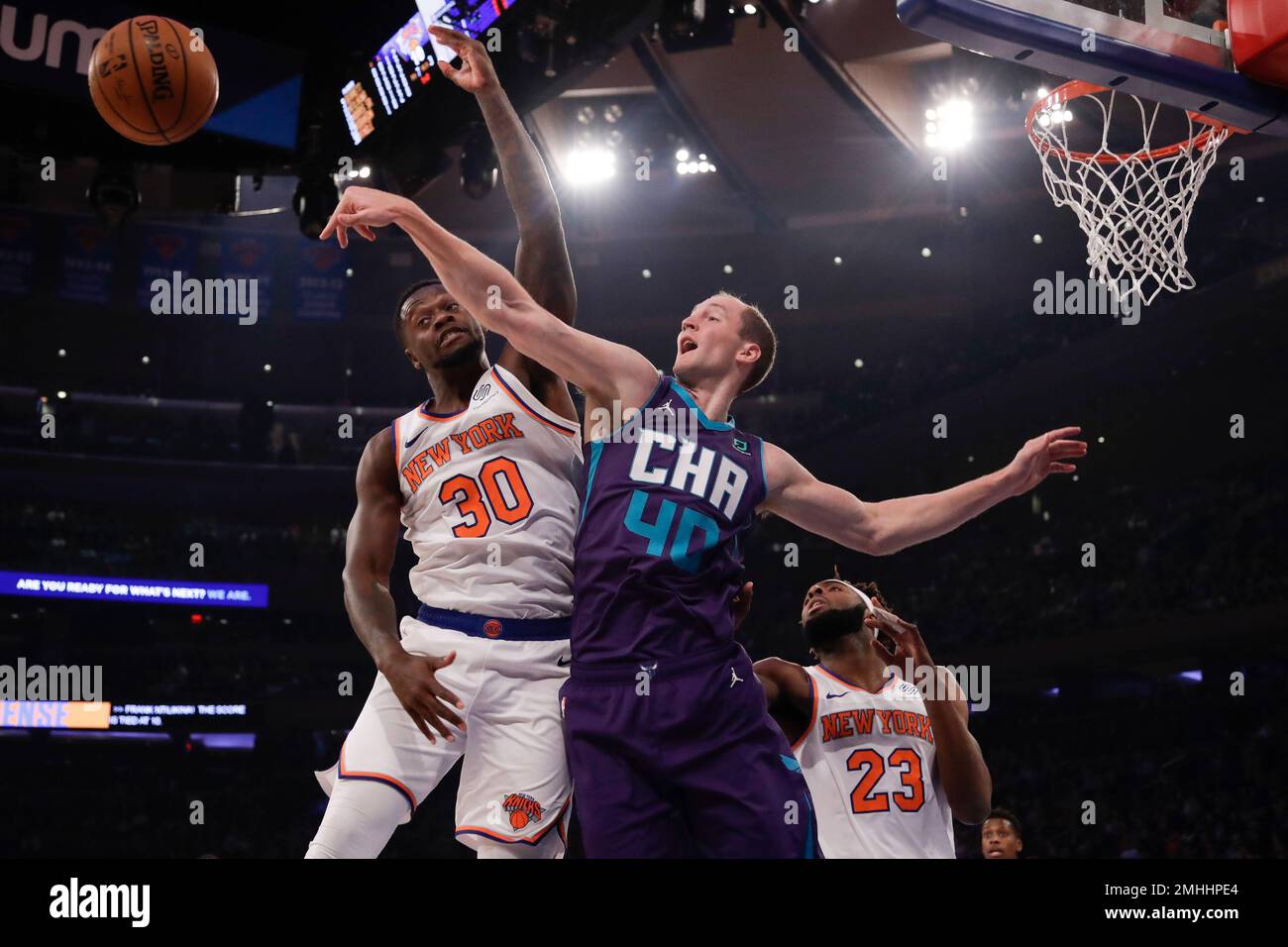 Charlotte Hornets' Cody Zeller (40) fights for a rebound with New York ...