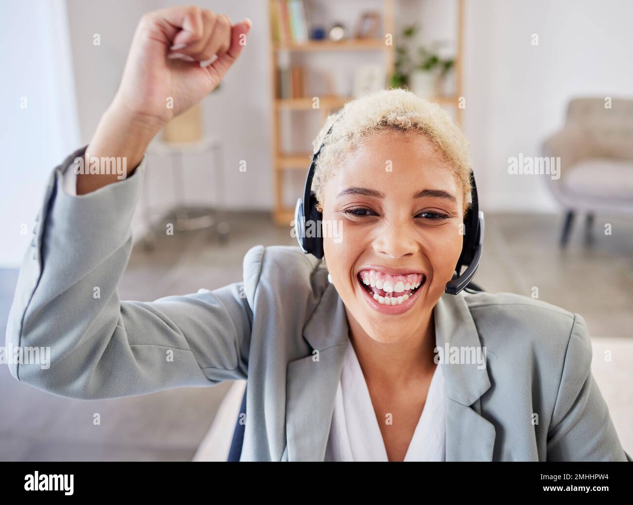 Winner, success or excited black woman in call center company in ...