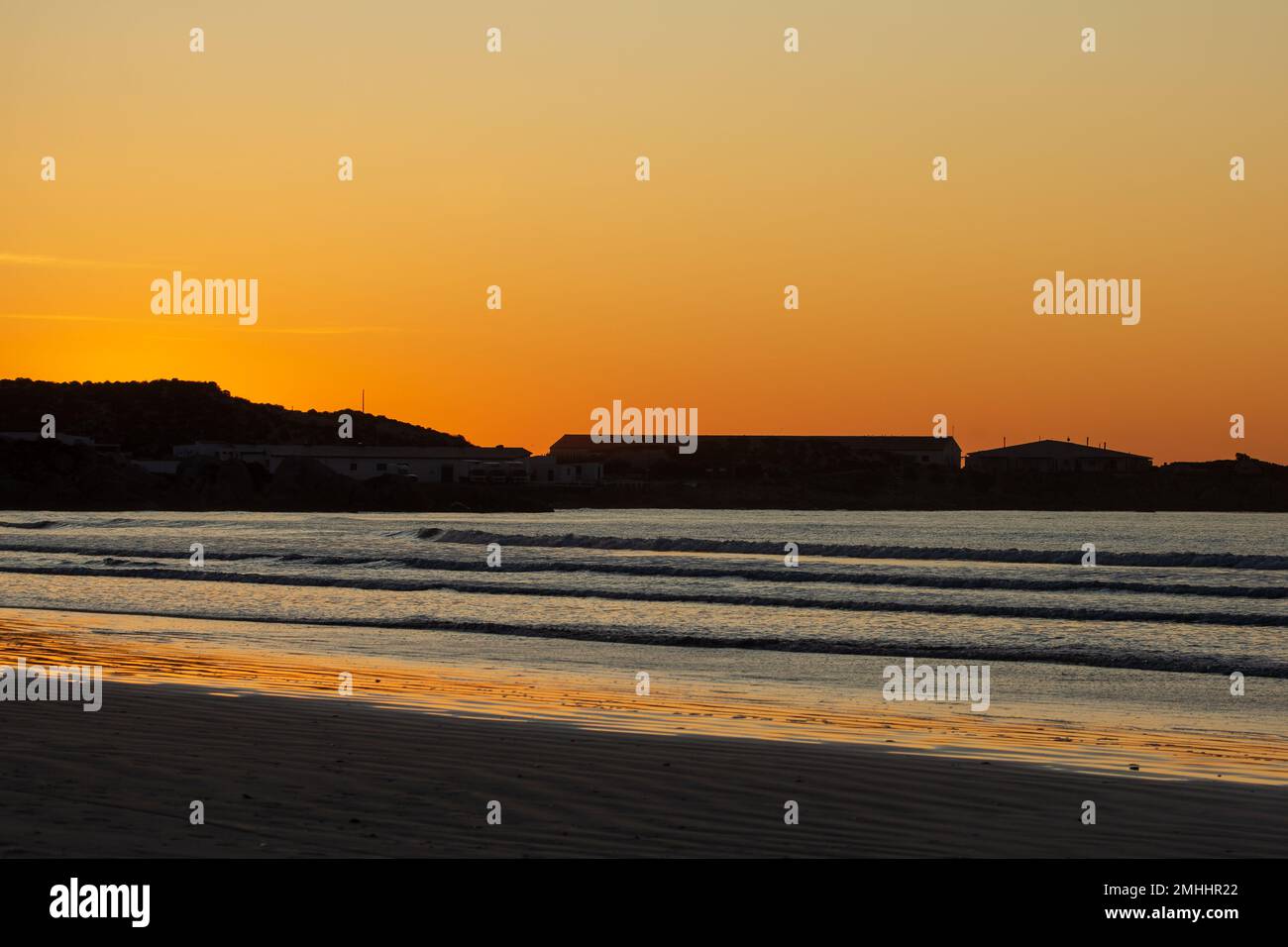 On the beach of Paternoster during sunset, orange sky, water, evening ...