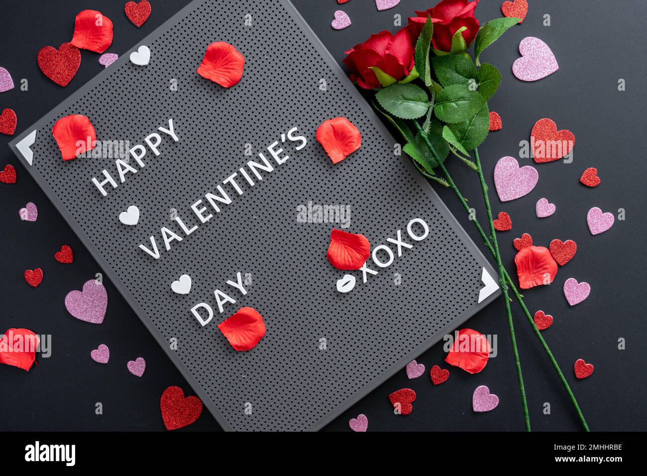 Beautiful Valentine's Day background with red hearts and red roses on ...