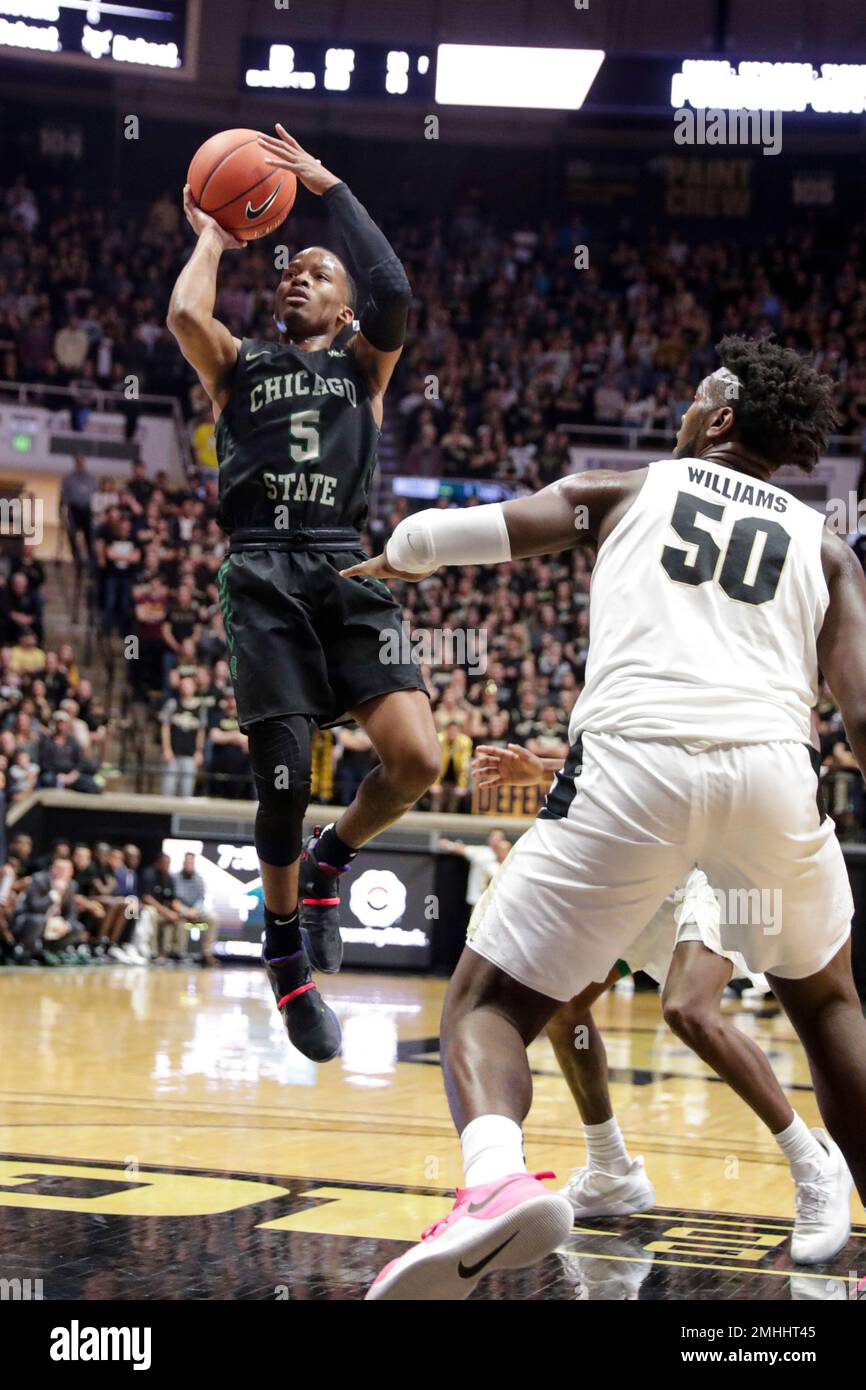 Chicago State guard Xavier Johnson (5) shoots over Purdue forward ...