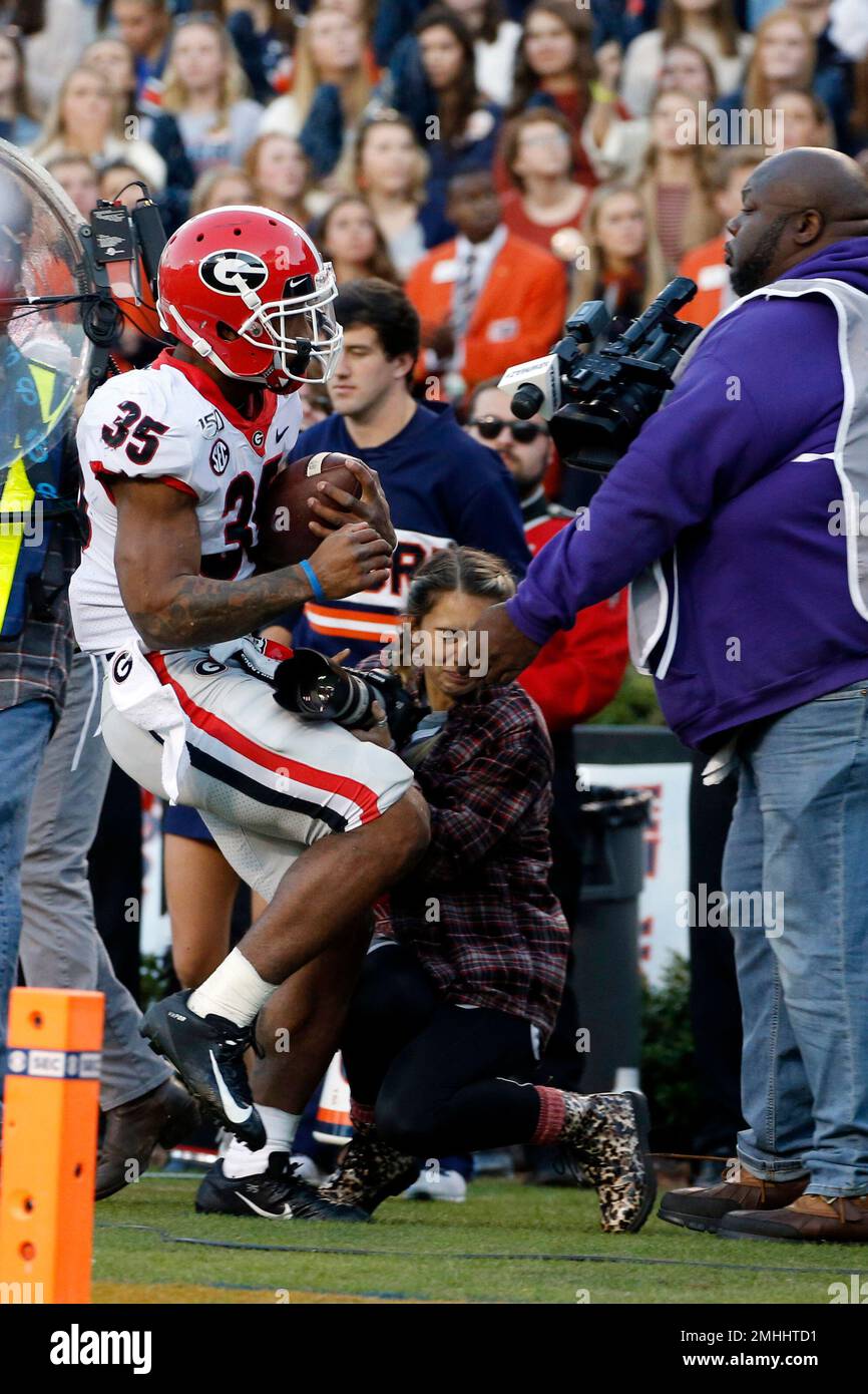 Georgia running back Brian Herrien (35) runs out of bounds and into a ...