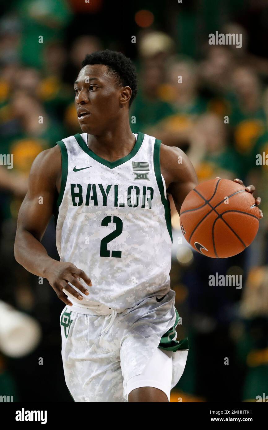 Baylor guard Devonte Bandoo (2) dribbles up court during an NCAA ...