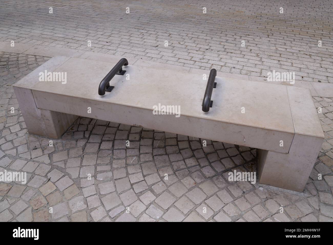 stone city bench seat with center arm rests on hostile design prevents ...